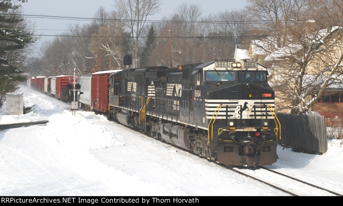 NS 18G's consist of mixed freight is eastbound at MP 48 @ 10:10